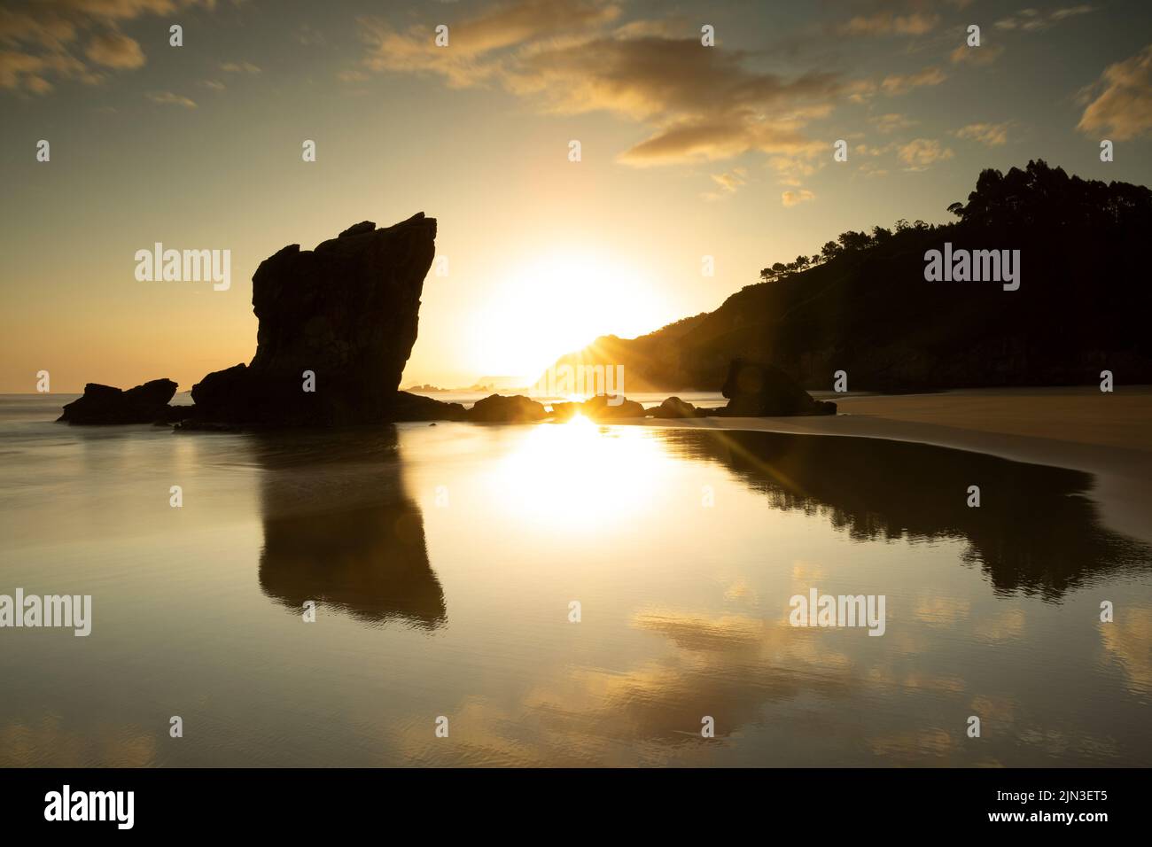 Landscape view of a stunning sunrise at Aguilar Beach in Muros de Nalon ...
