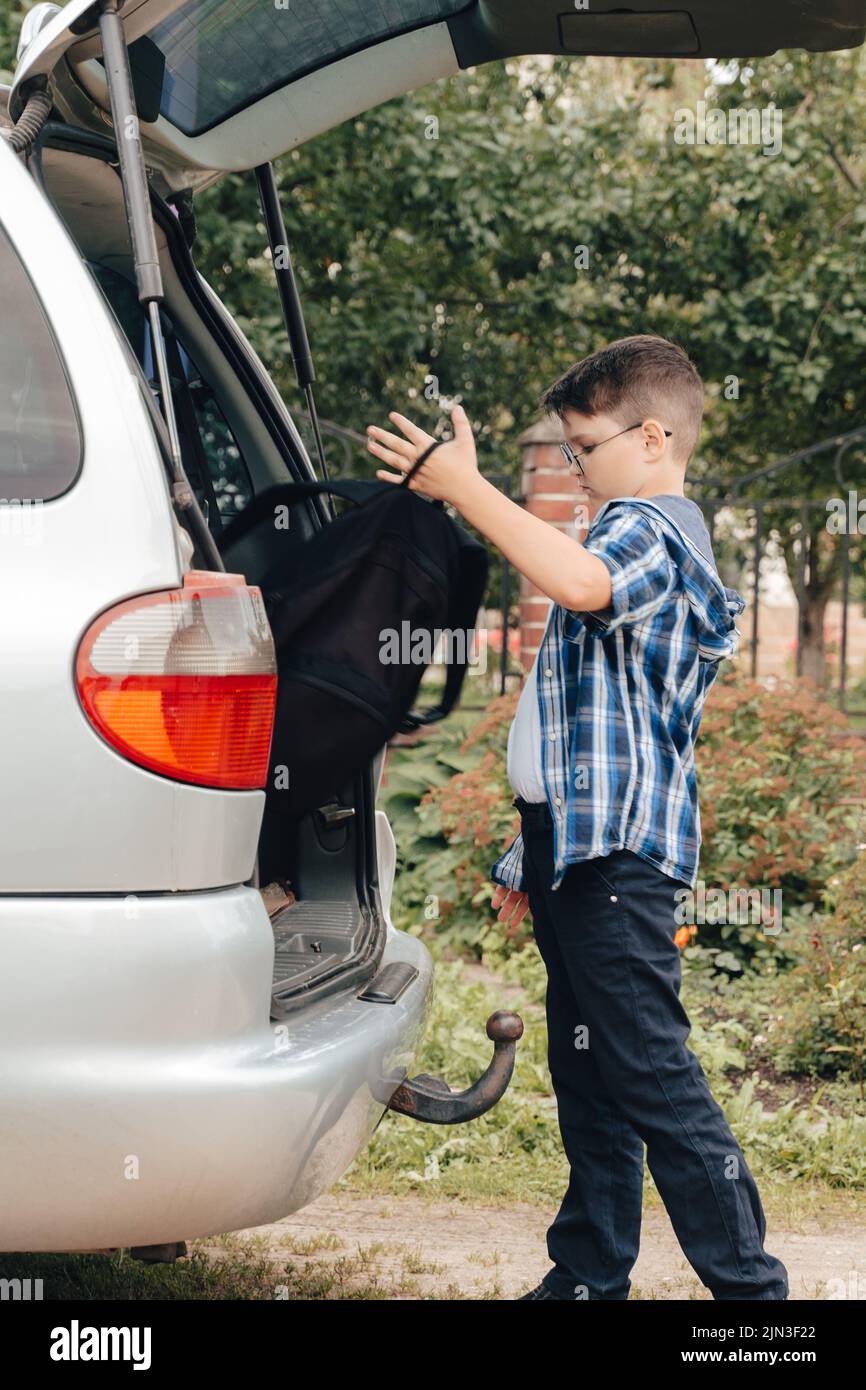 Child getting into car at school hi-res stock photography and images ...