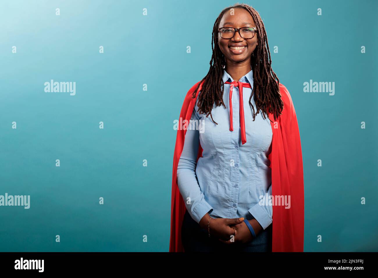 Positive smiling heartily mighty and brave justice defender standing on ...