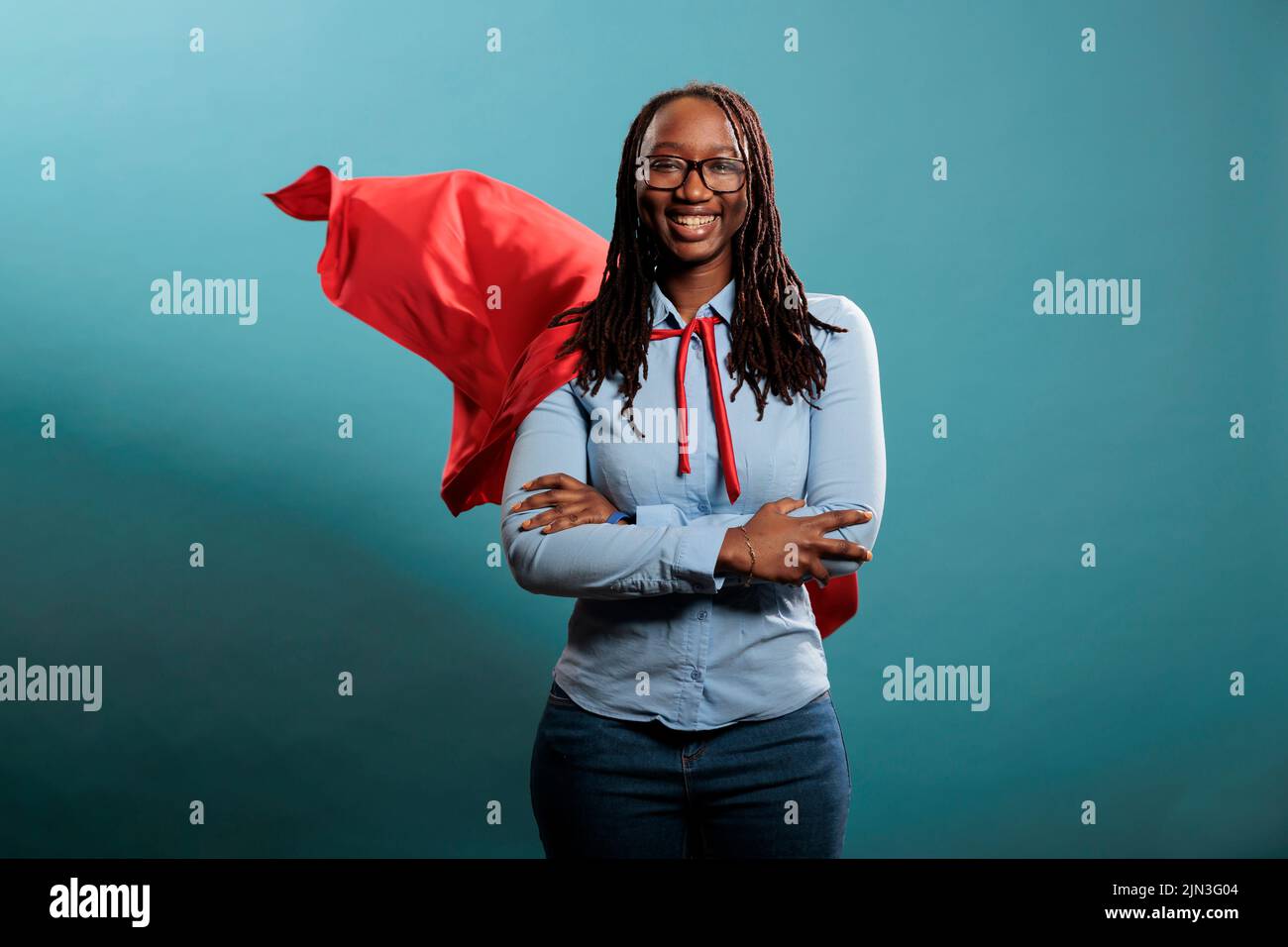 Confident looking mighty powerful young adult person wearing superhero ...