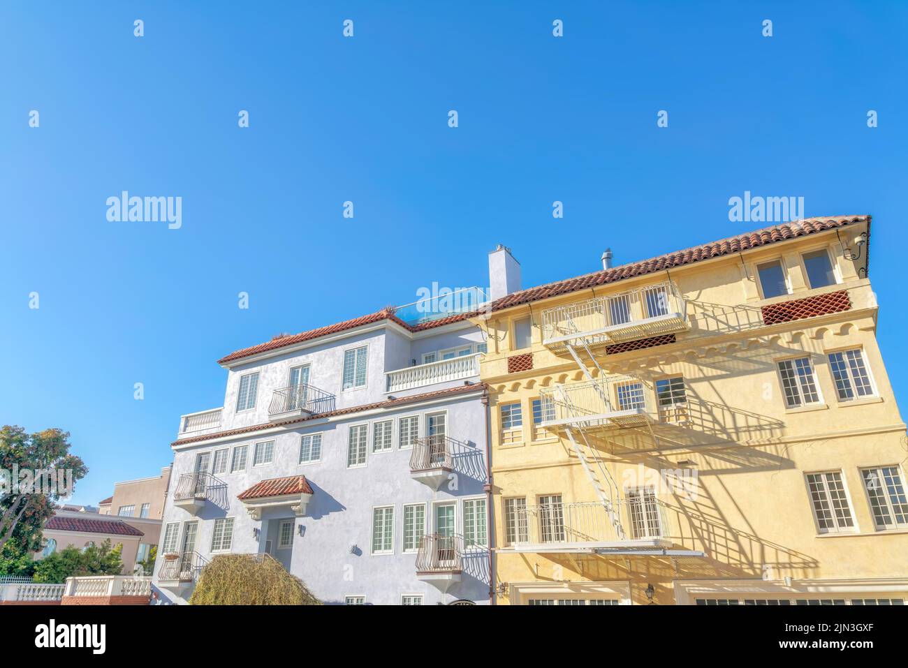Two adjacent apartment buildings with clay roof tiles at San Francisco ...