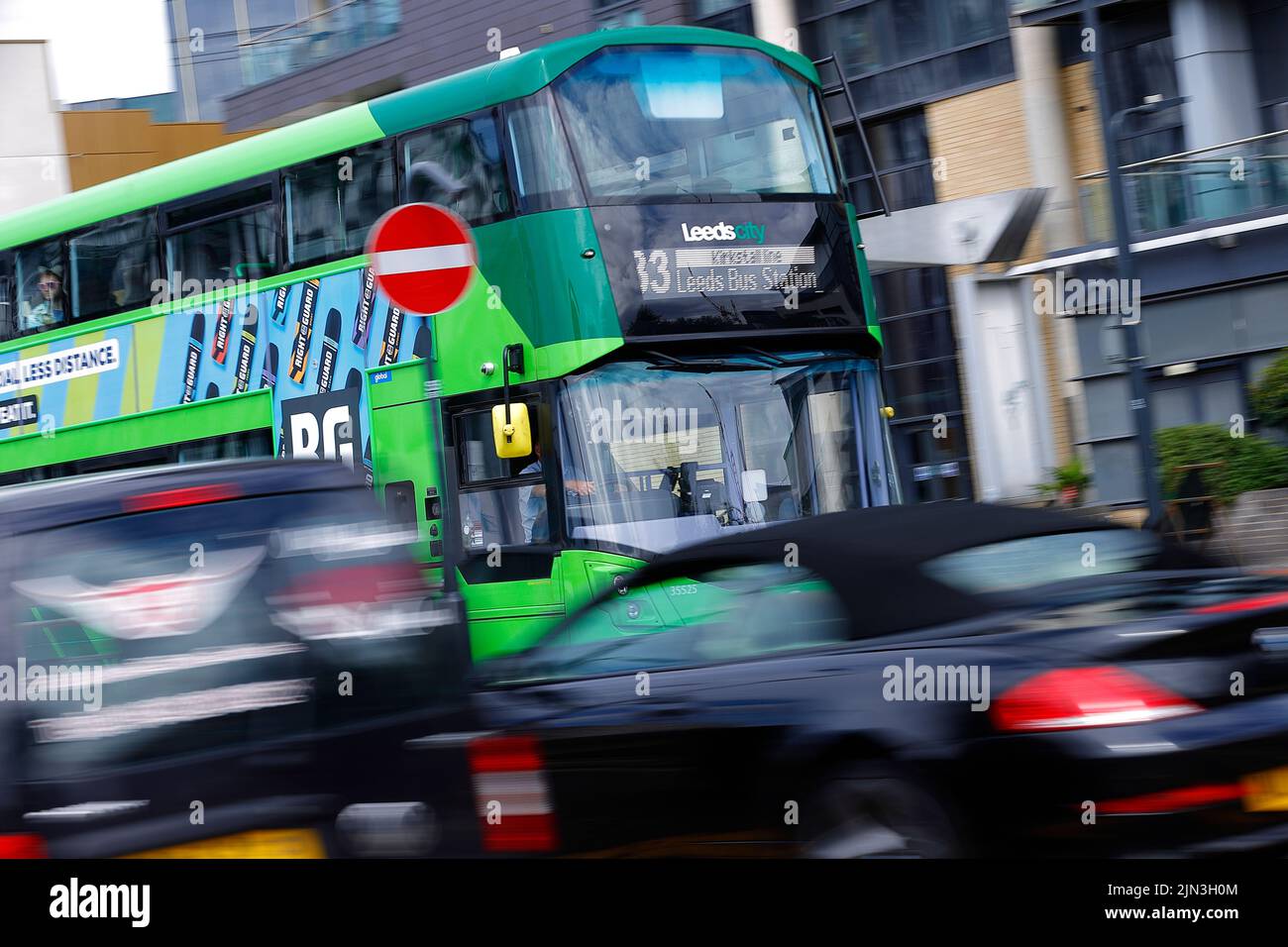 A double decker bus waiting to turn into Leeds Bus Station from St ...