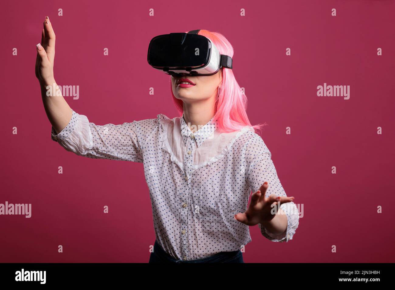 Portrait of one person with pink hair playing with vr goggles, using 3d ...