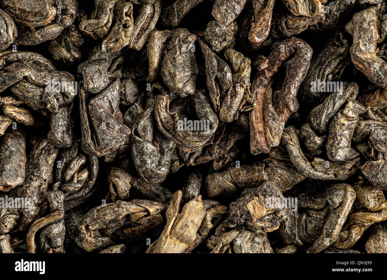 Green gunpowder tea, dry leaves under microscope, image width 23mm ...