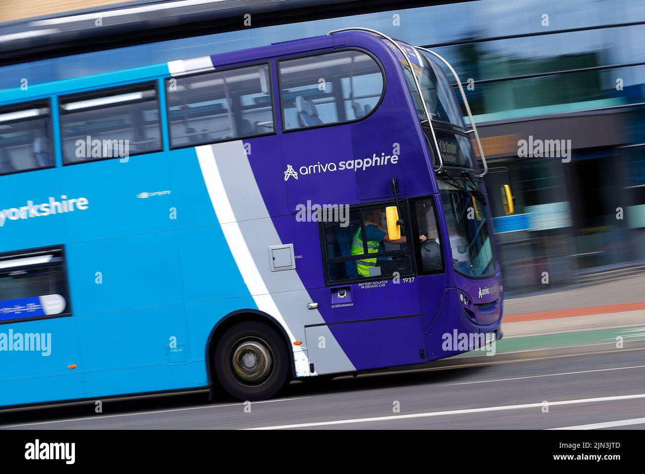 A moving double decker bus operated by Arriva, seen driving through ...