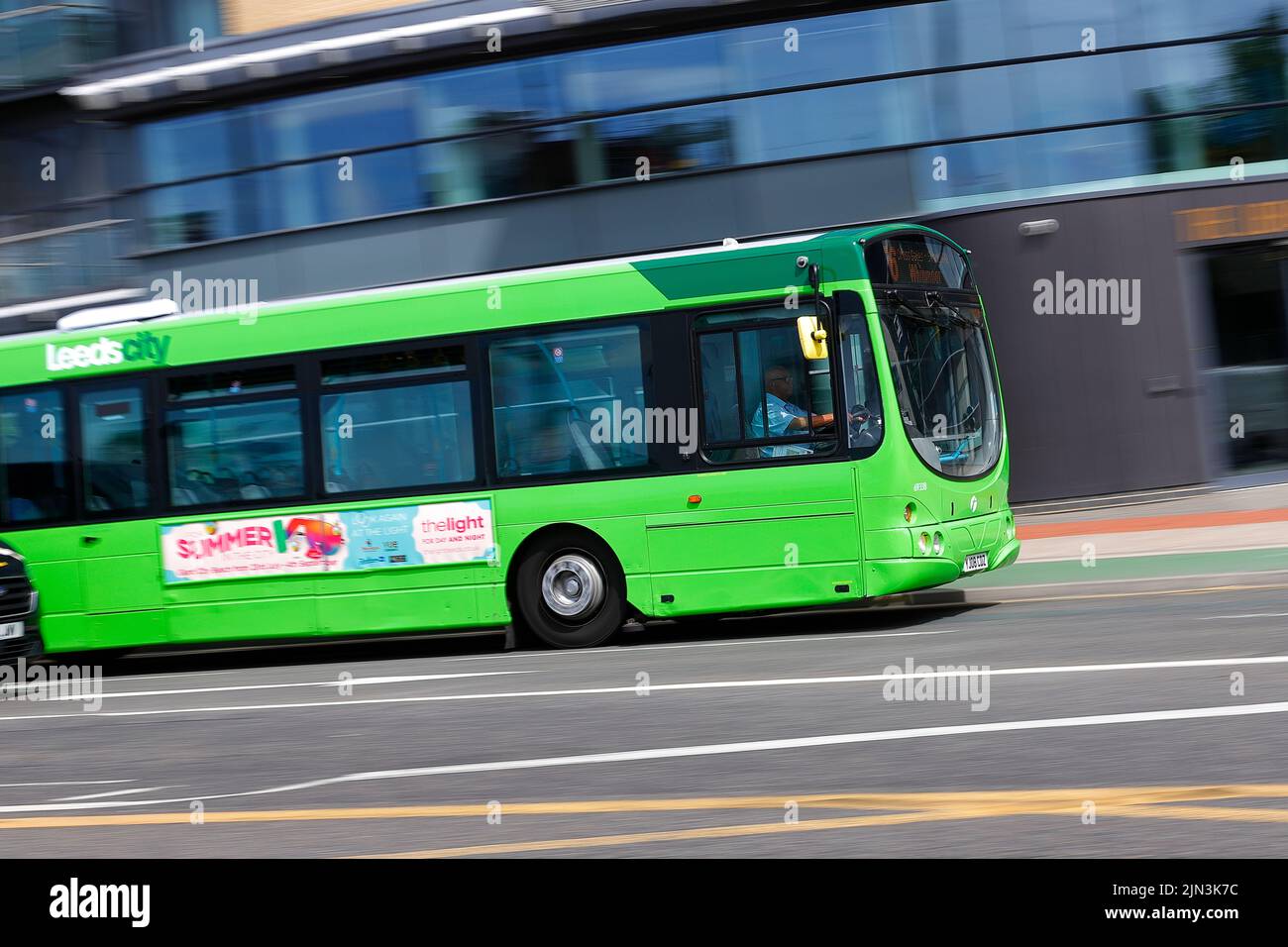 A panning shot of a LeedsCity single deck bus operated by First Bus ...