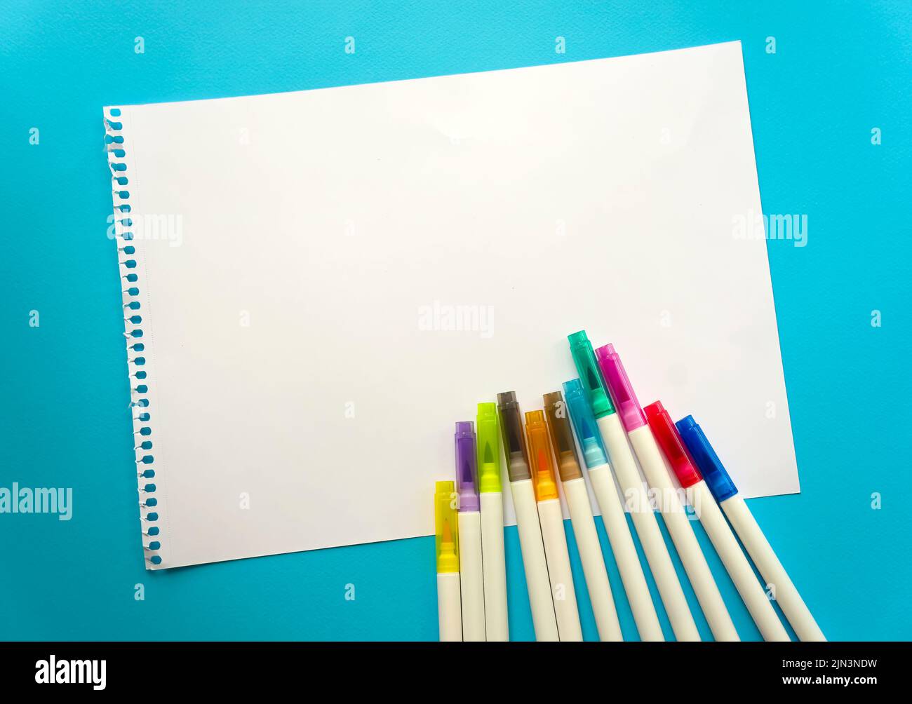 Creative kids, concept. Colorful crayon paints and blank notepad on ...