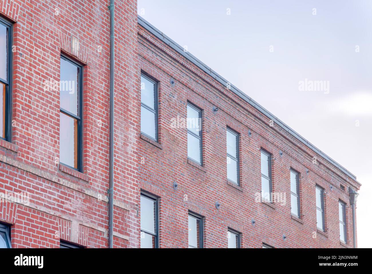 Building with bricks and single-hung windows at San Francisco ...