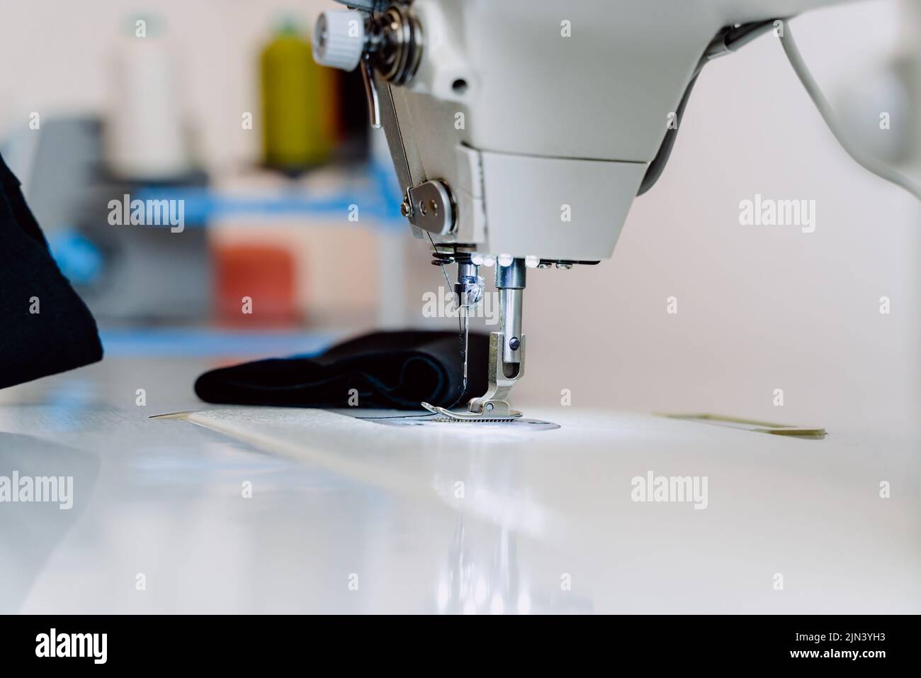 Professional white sewing machine in dressmaker Stock Photo - Alamy