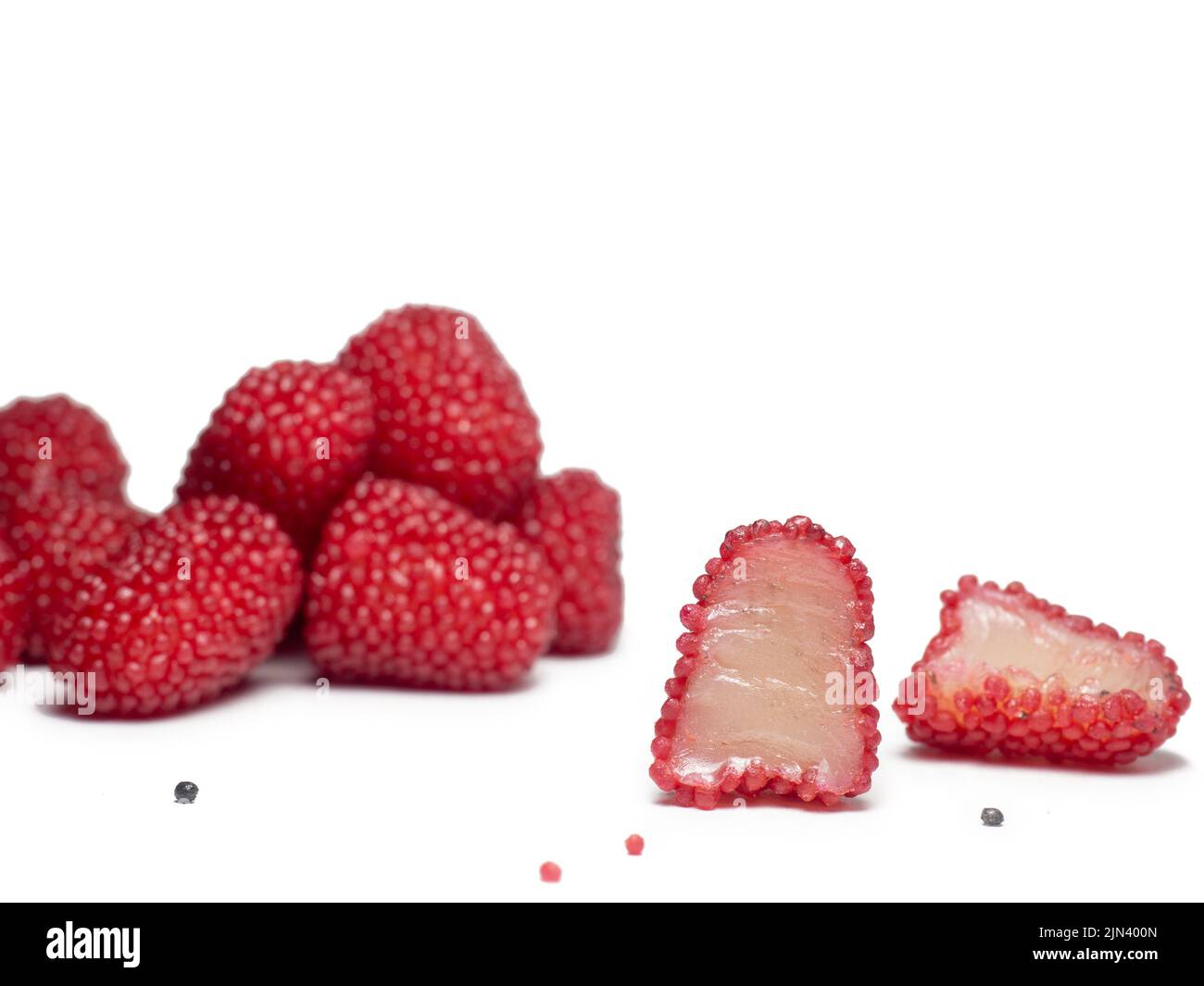 red chewing sweets in the form of berries. Sweets in the form of ...