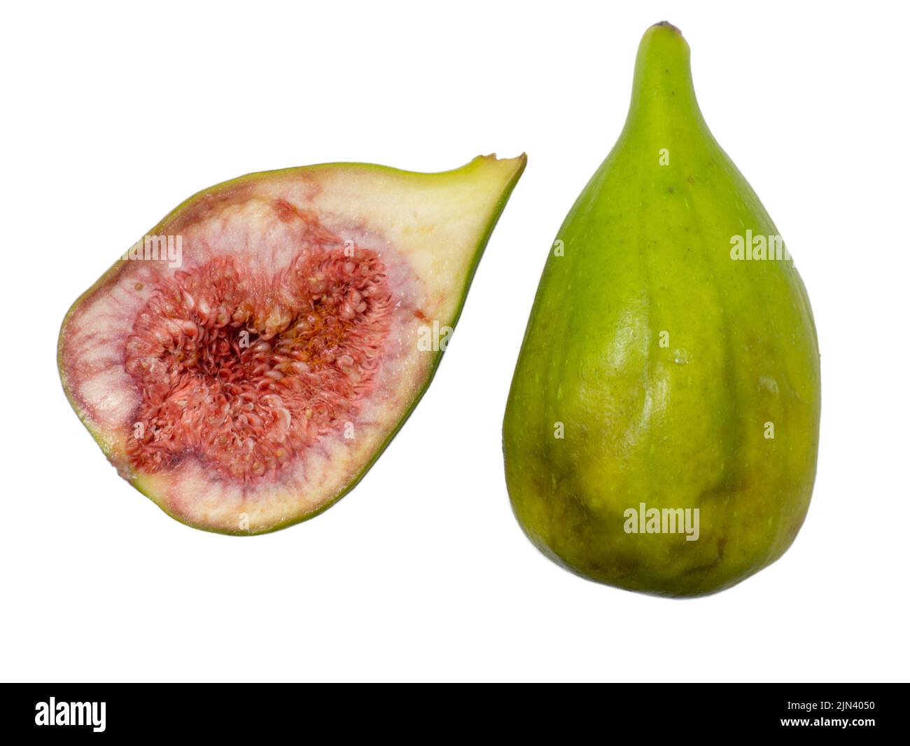 Fig cut in half. Fresh raw fruit. Fig. Figs with seeds. The pulp of a ...