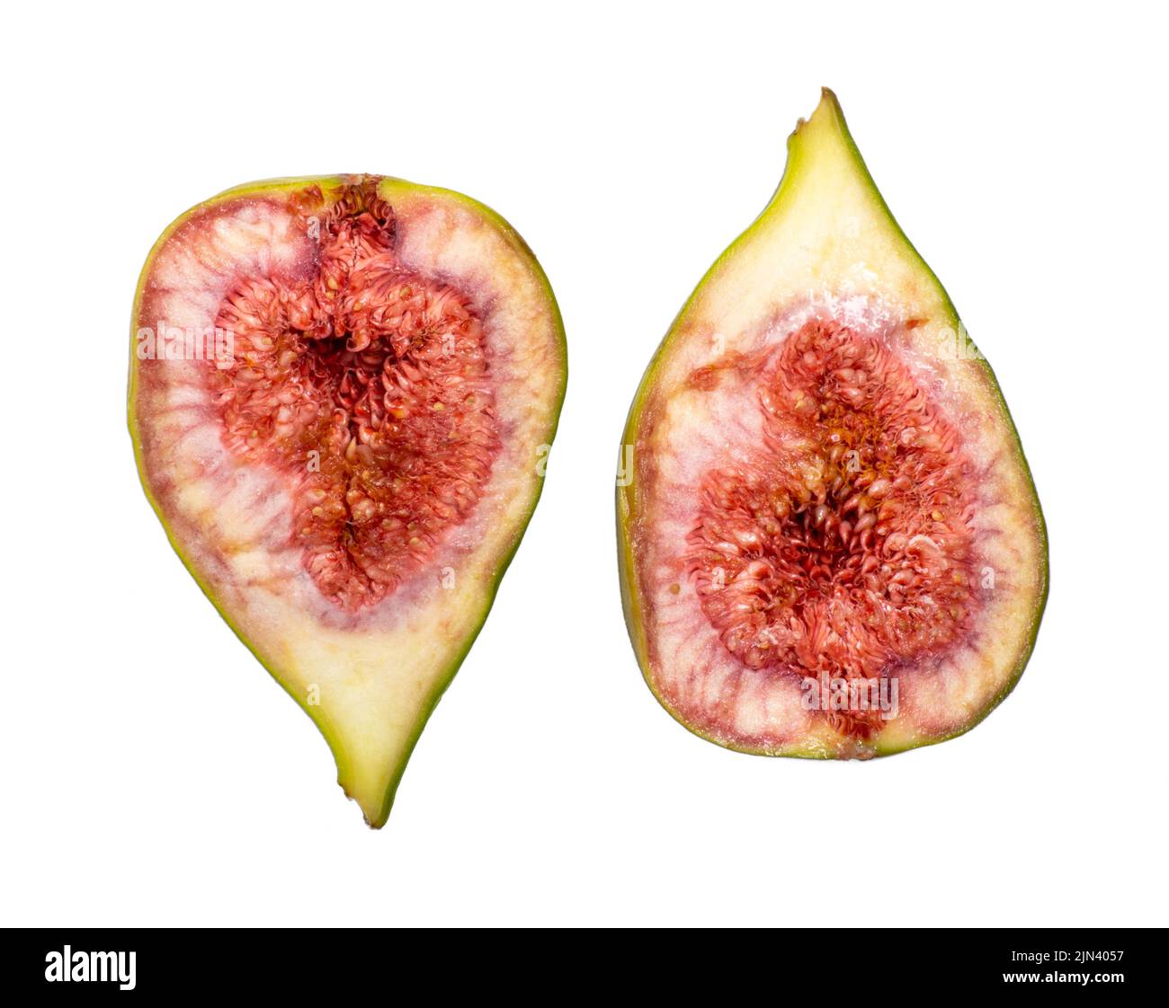 Fig cut in half. Fresh raw fruit. Fig. Figs with seeds. The pulp of a ...
