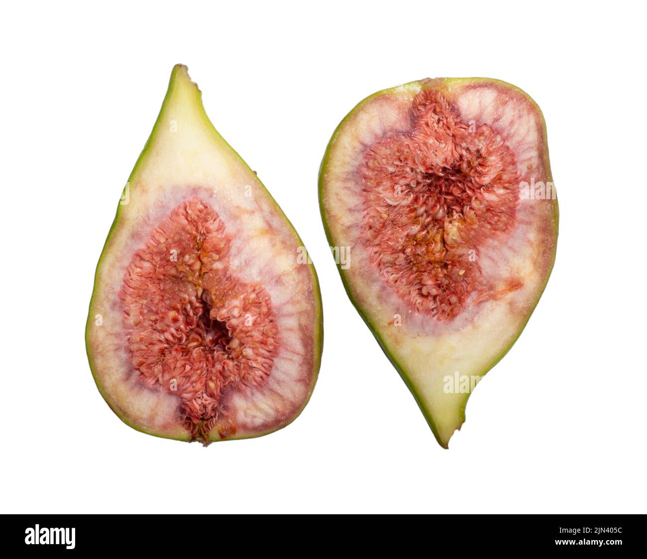 Fig cut in half. Fresh raw fruit. Fig. Figs with seeds. The pulp of a ...