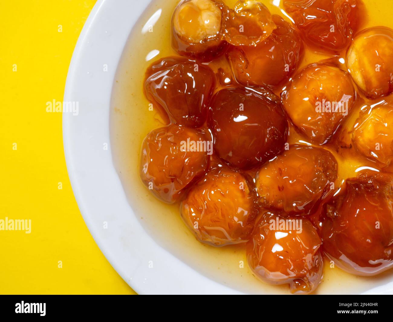 Cherry jam stuffed with nuts. Sweet treat. Jam in a bowl for tea ...