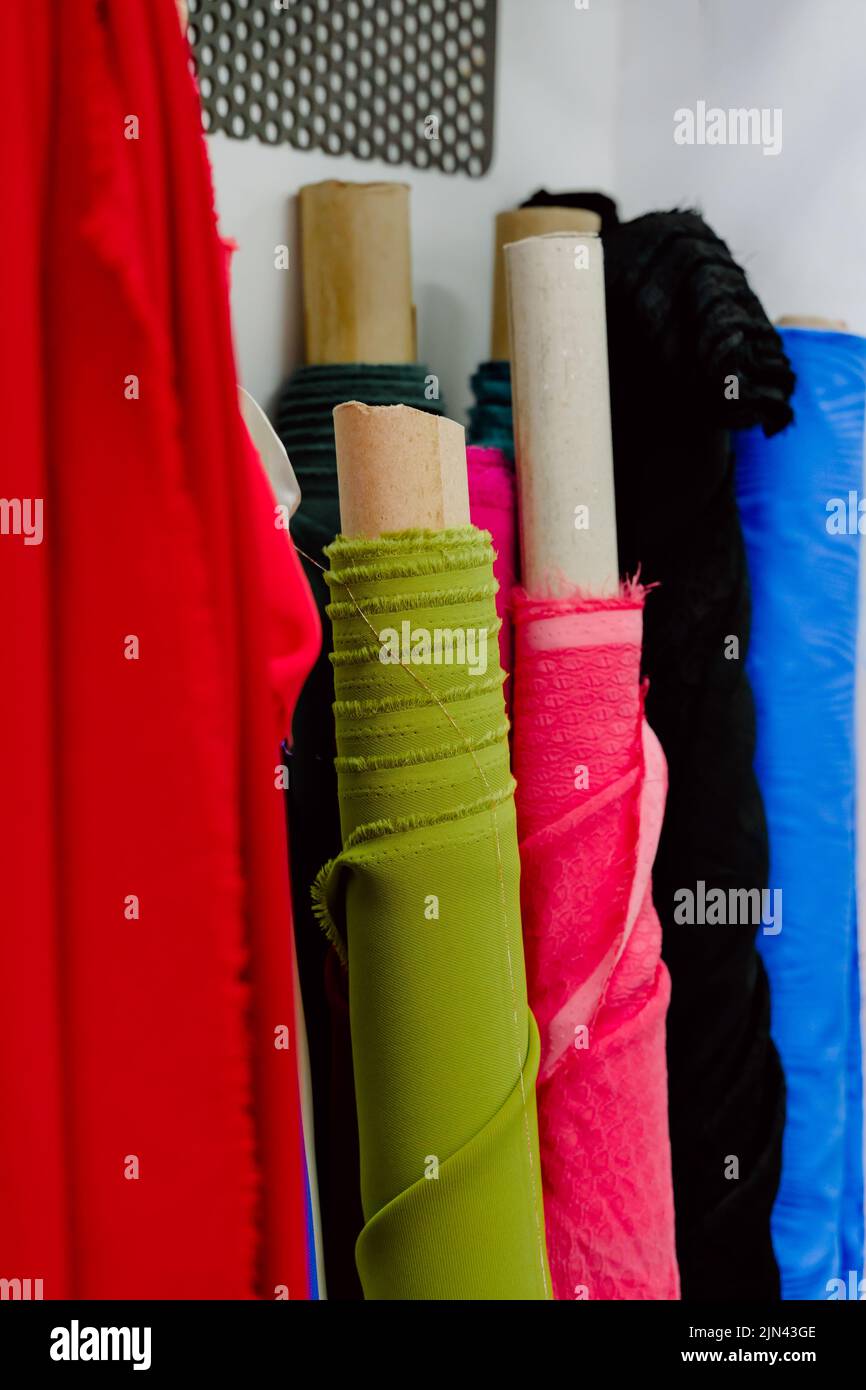 tubes of fabrics with which to design garments Stock Photo - Alamy