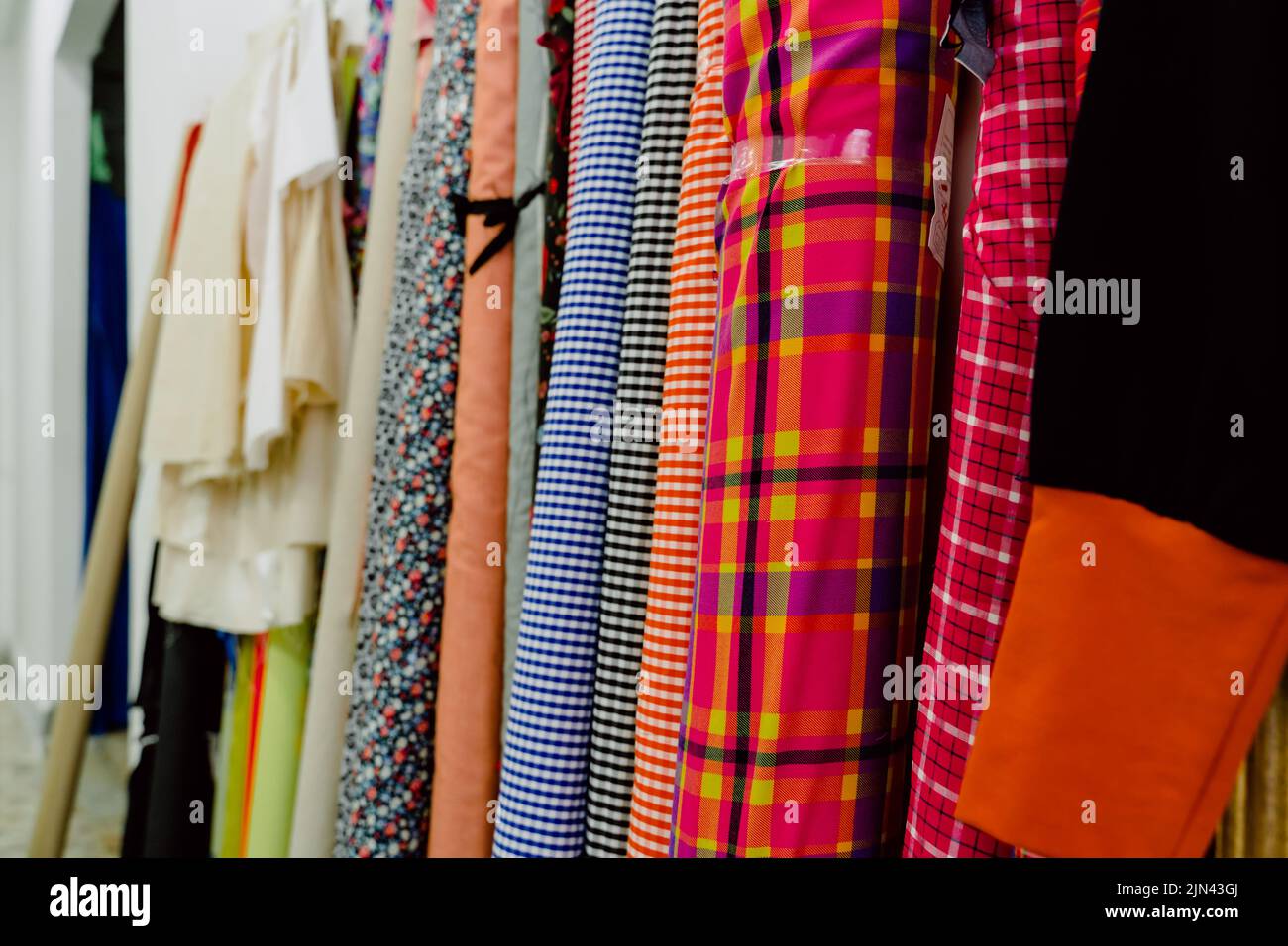 tubes of fabrics with which to design garments Stock Photo - Alamy