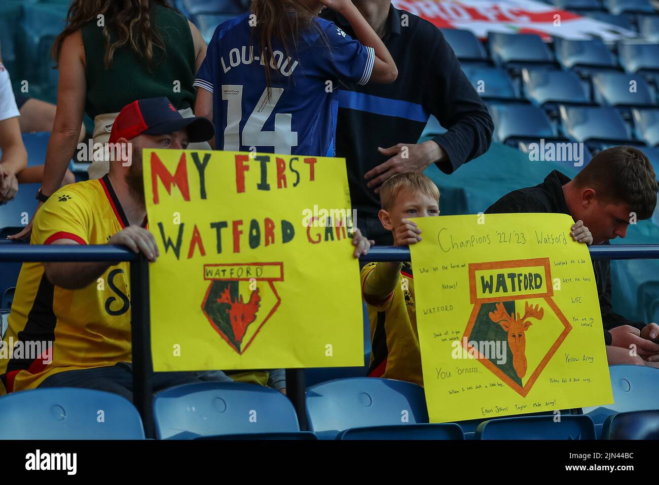 A young Watford fan with a sign showing his support Stock Photo - Alamy