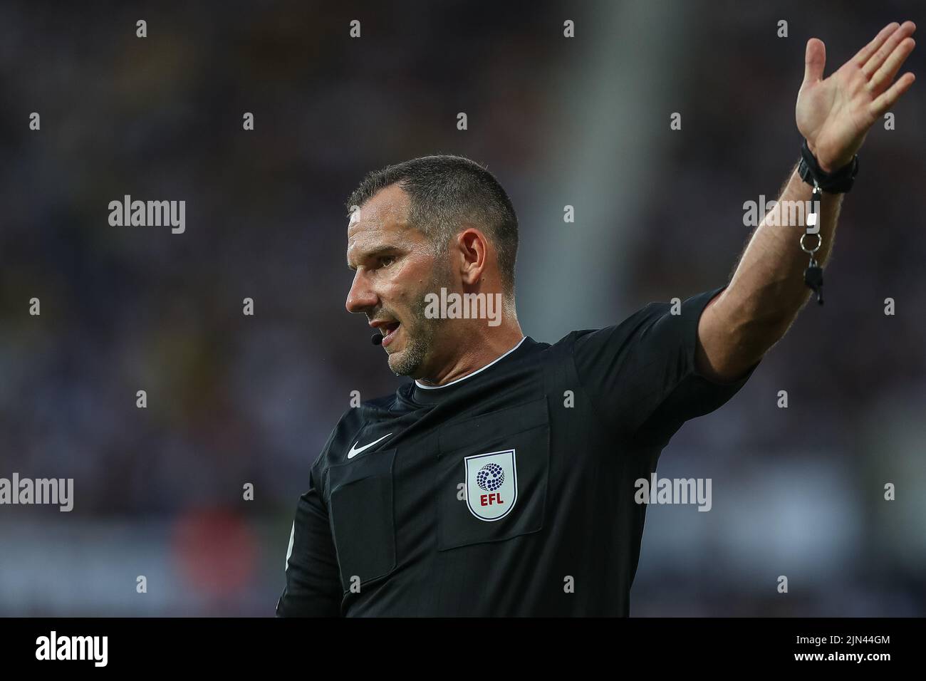 Referee Tim Robinson gives a corner kick Stock Photo - Alamy