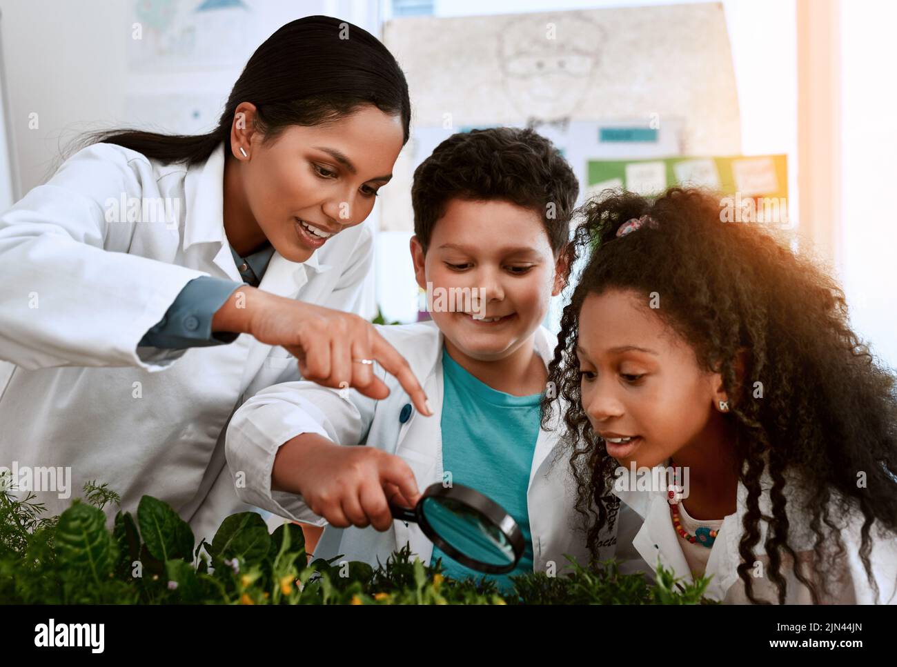 The world is yours to explore. an adorable little boy and girl learning ...