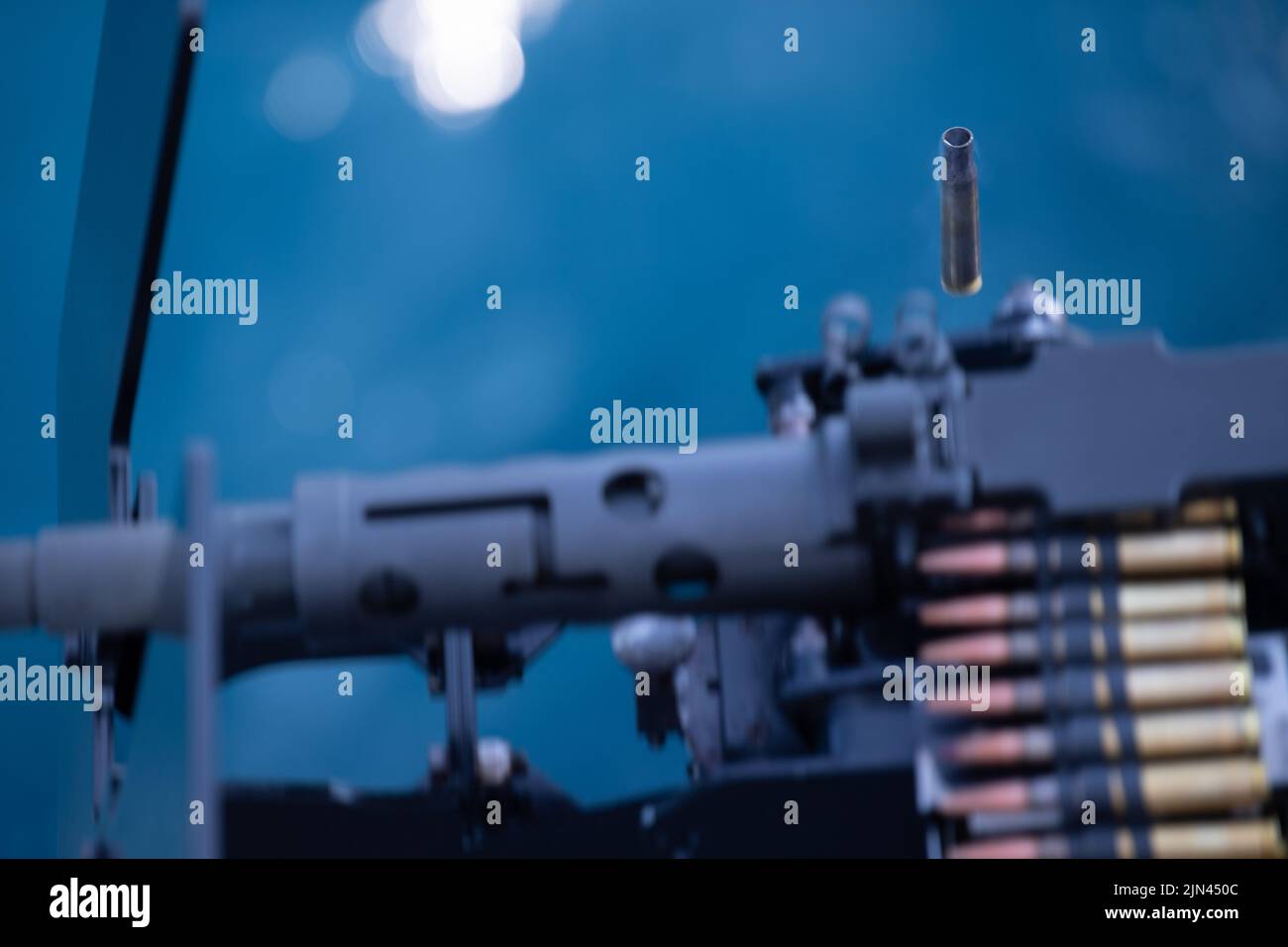 A detail shot shows a freshly fired shell as its ejected from the .50 ...