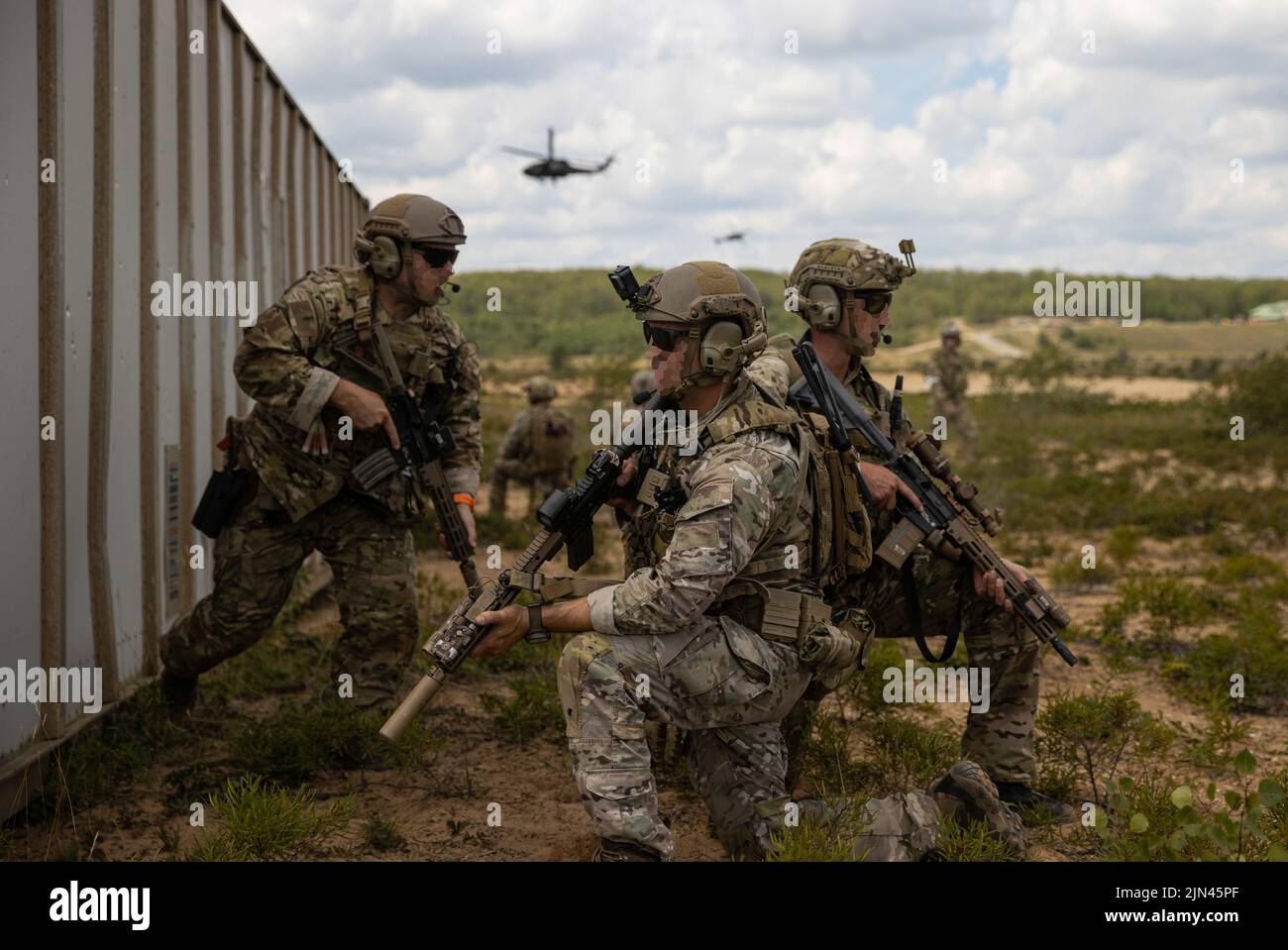 Operators from the 20th Special Forces Group conduct an aerial assault ...