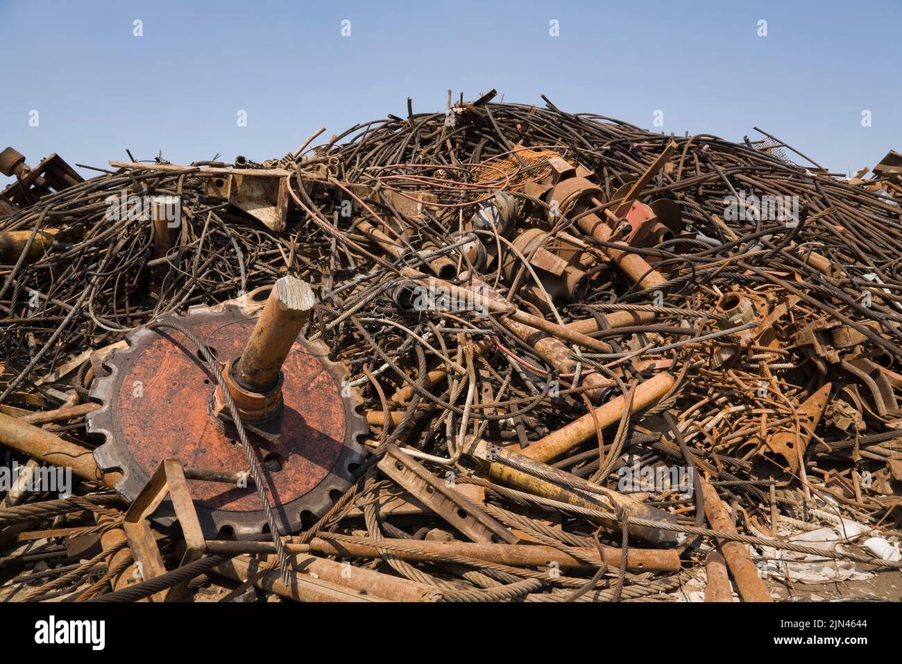 Pile of assorted rusted ferous metal parts and pieces at scrap metal ...