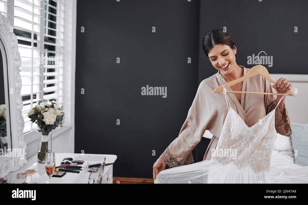 Its the day shes been waiting for. an attractive young bride getting ...