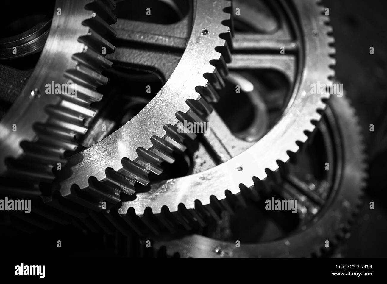 Pile of metal cogwheels for spiral gear drive in warehouse Stock Photo ...