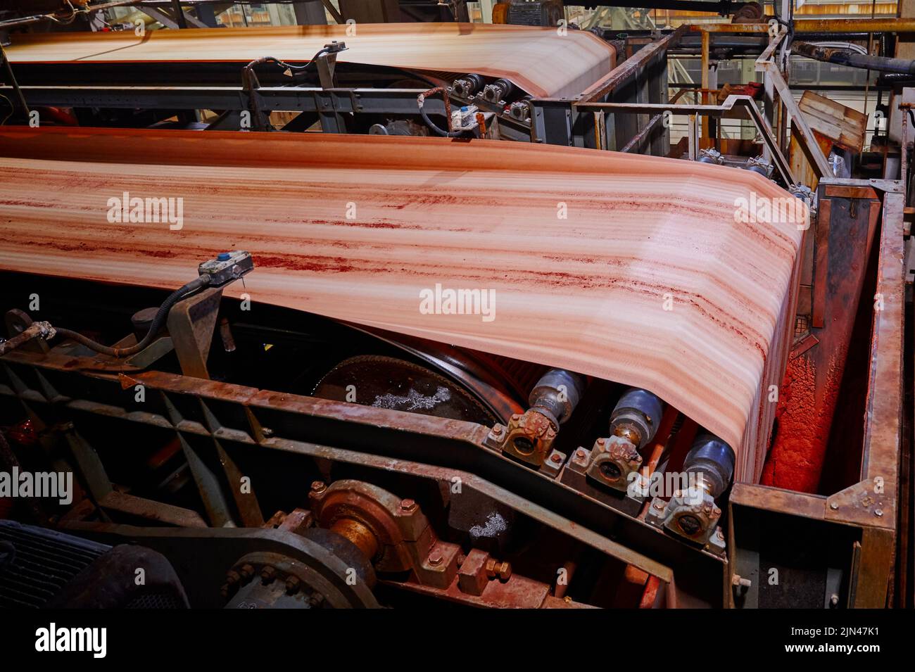 Colorful mineral salt material transported by conveyor belt Stock Photo ...