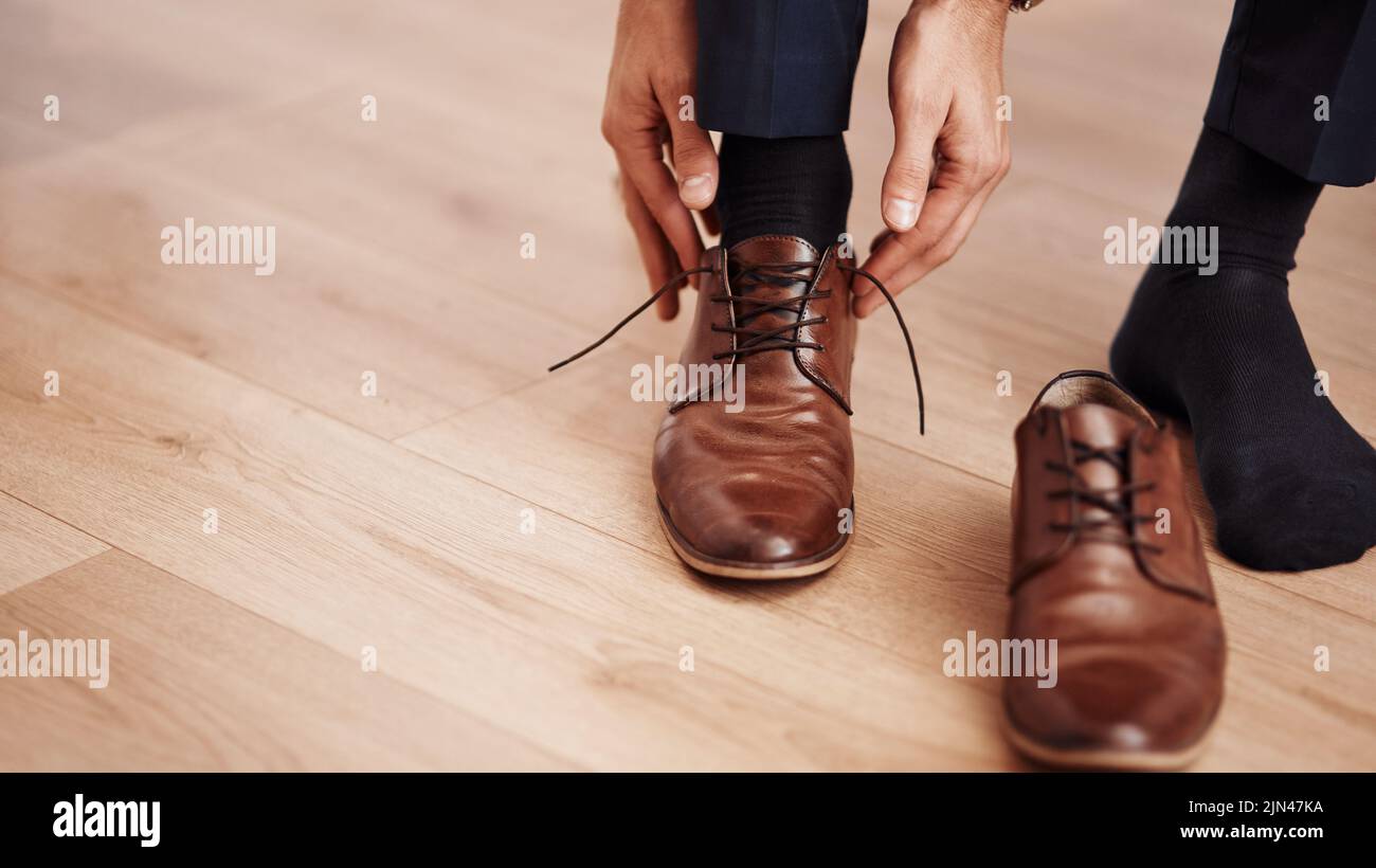 Im ready for this. an unrecognizable man putting on his shoes Stock ...