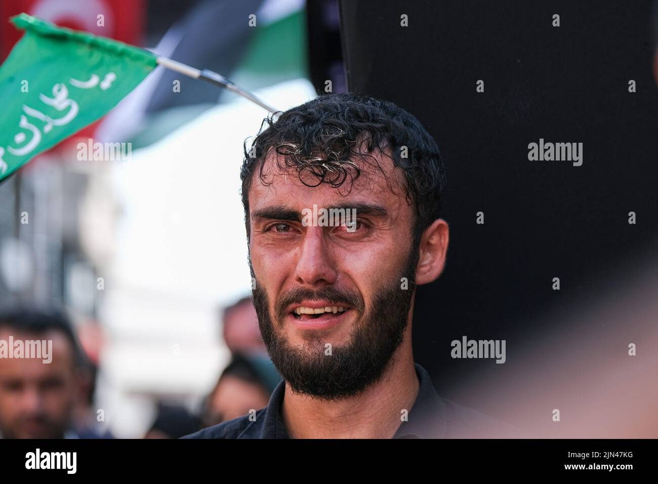 A Shiite Muslim man mourns during the procession. The first month in ...
