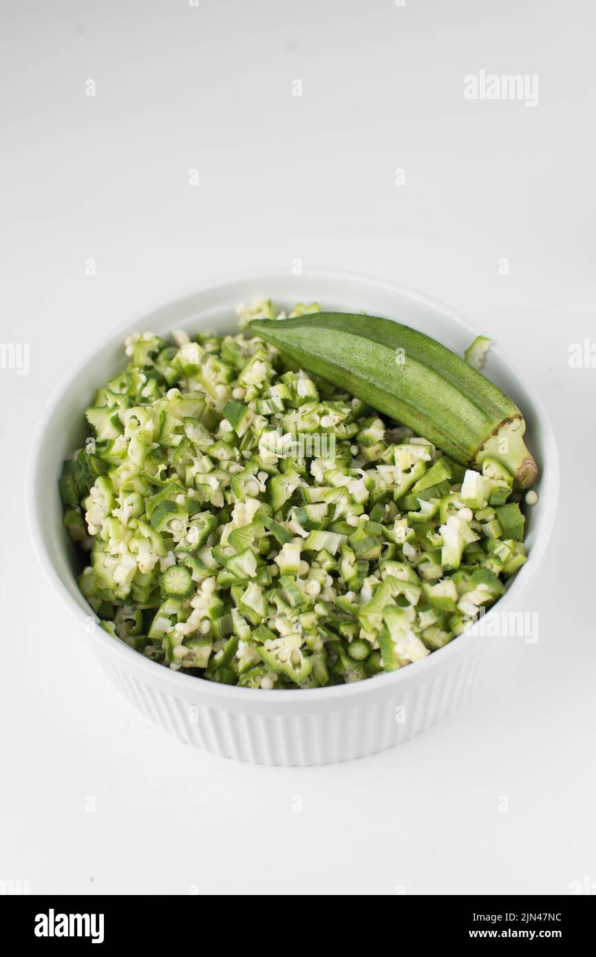 Chopped okra in a white ramekin, chopped lady fingers Stock Photo - Alamy
