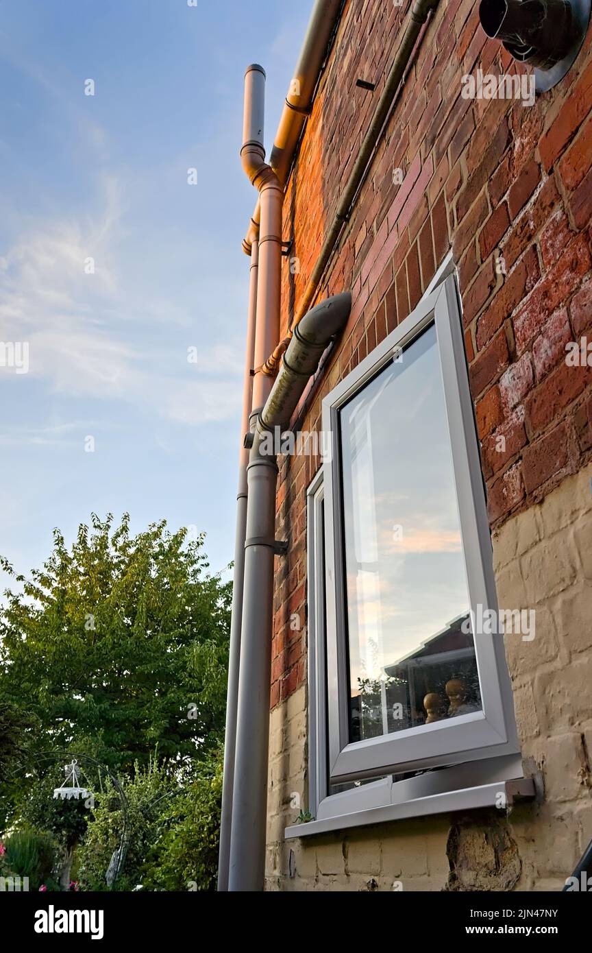looking up at a house exterior with a new double-glazed window at ...