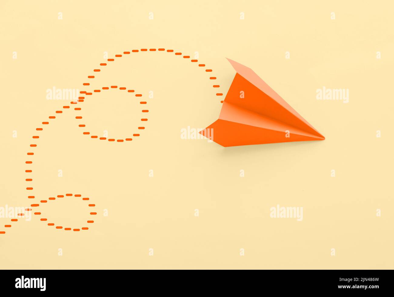 Paper plane on beige background Stock Photo - Alamy