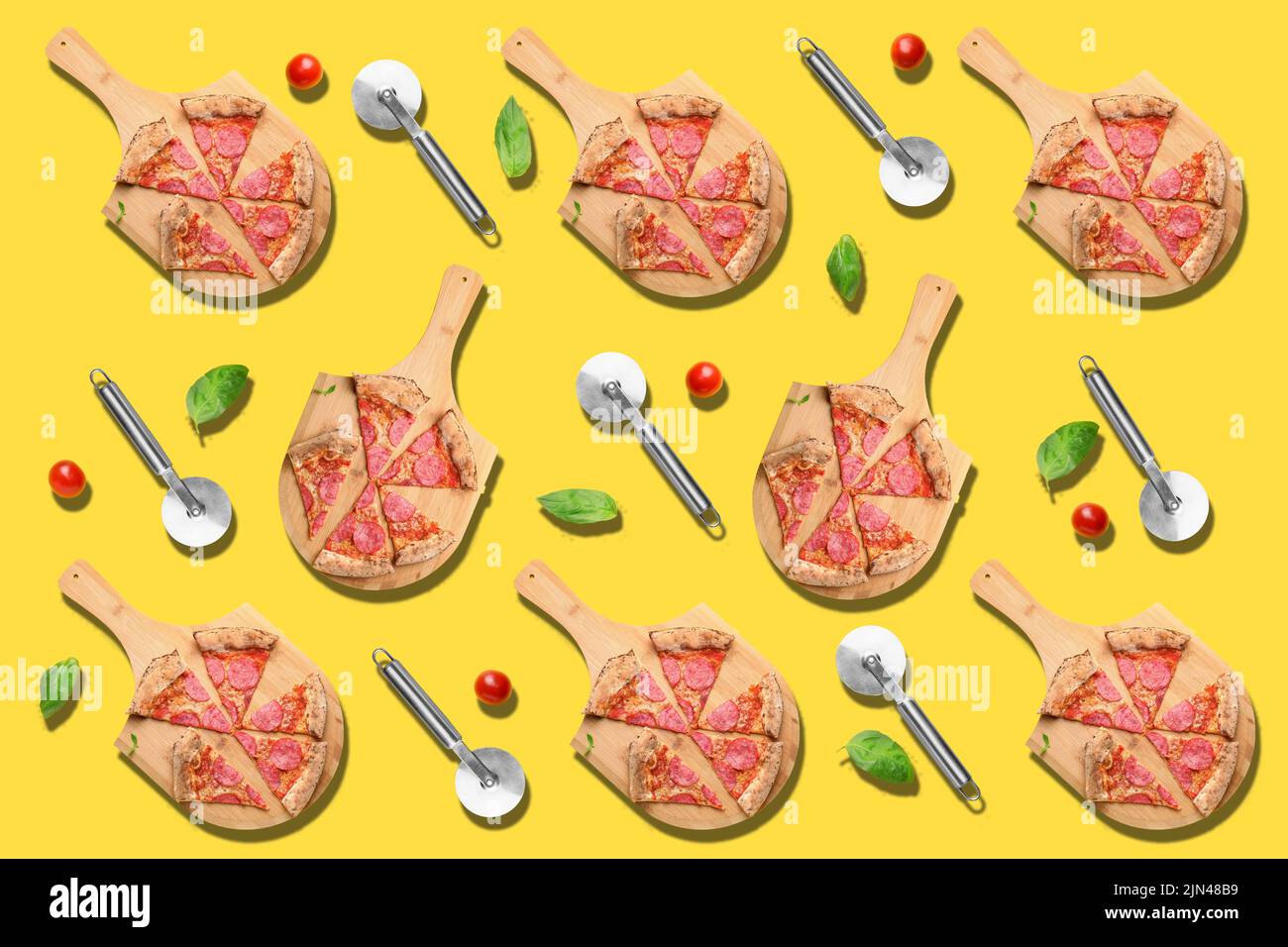 Many tasty cut pizzas and knives on yellow background. Pattern for ...