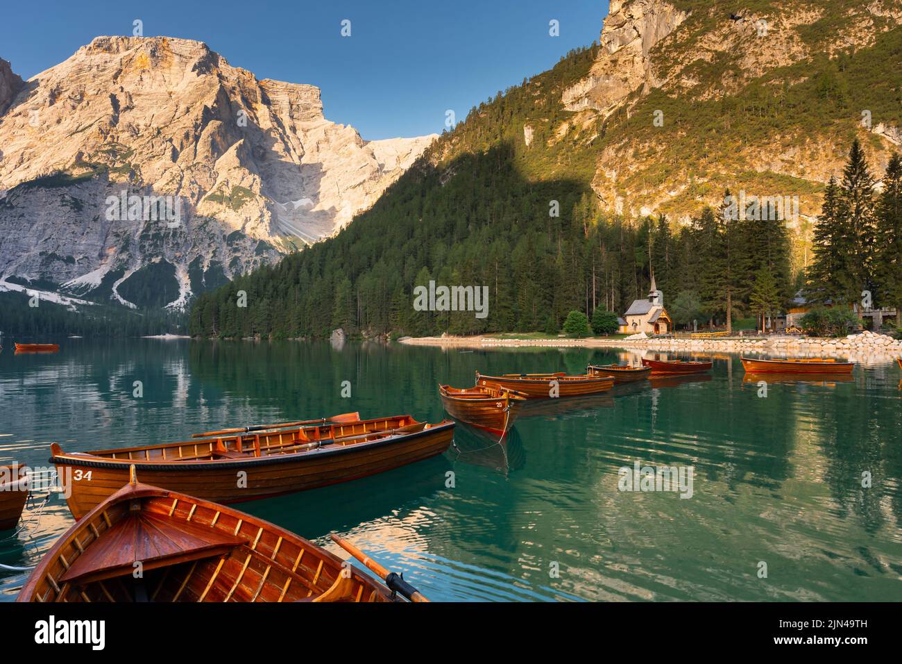 Amazing Sunrise view of Lago di Braies (Pragser Wildsee) with Wooden ...