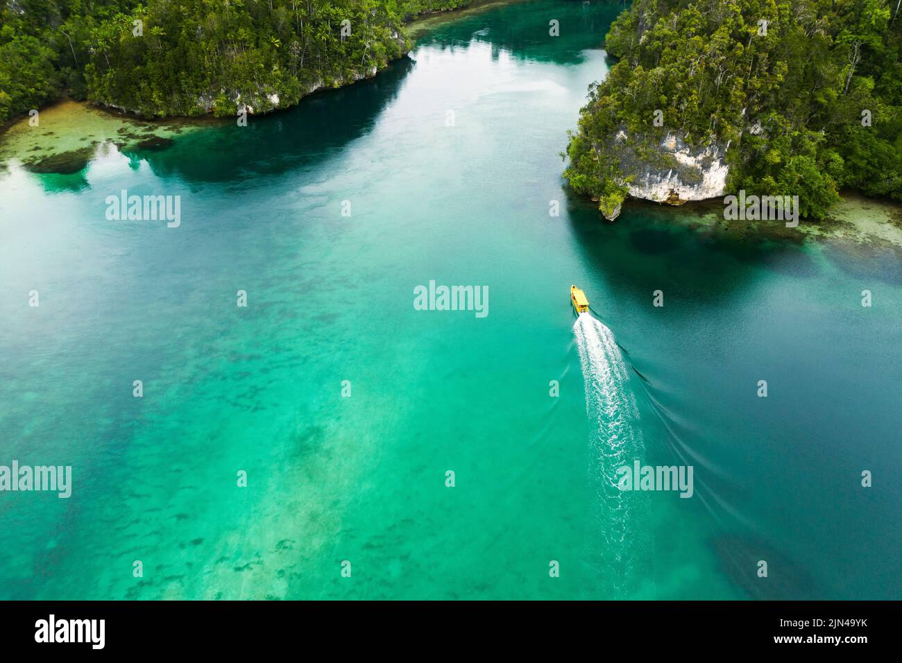 Fun times lie ahead. High angle shot of a boat sailing through a canal ...