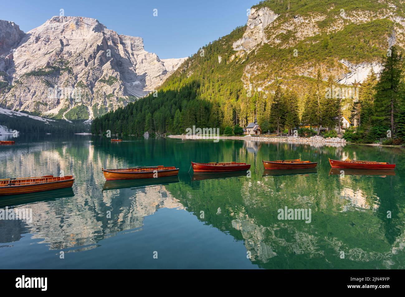 Amazing Sunrise view of Lago di Braies (Pragser Wildsee) with Wooden ...