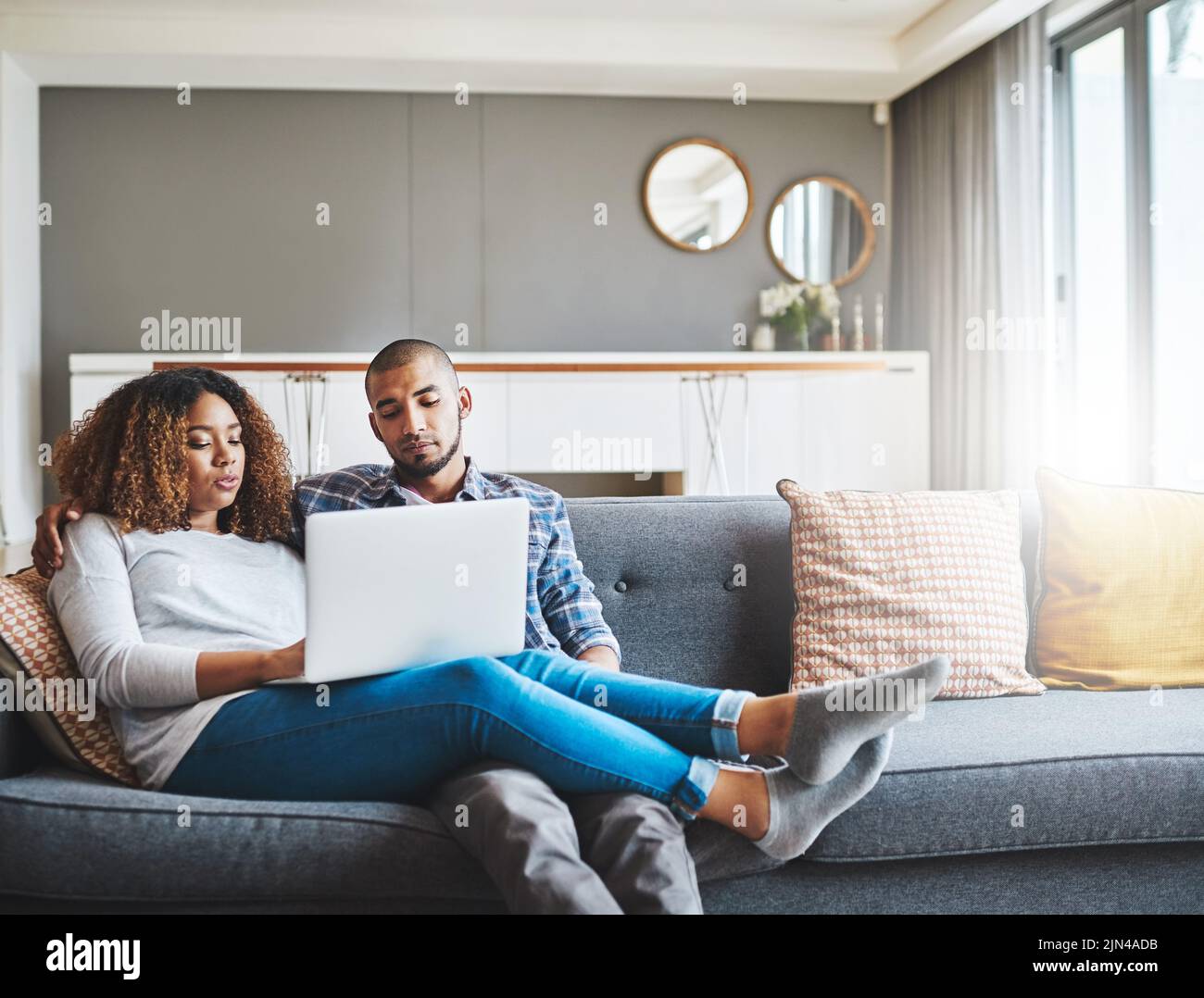 Relaxed couple sitting couch hi-res stock photography and images - Alamy