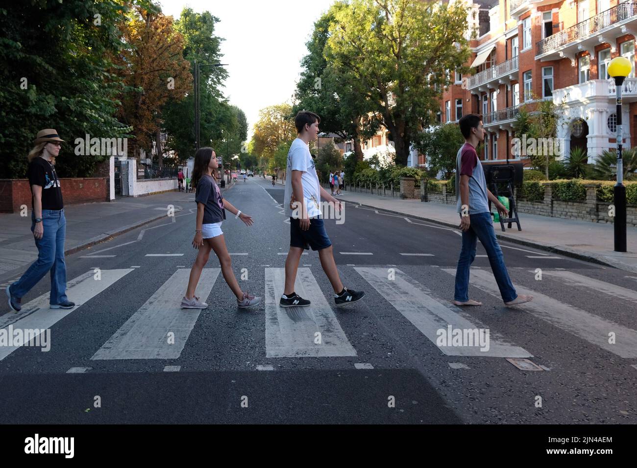London, UK, 8th Aug, 2022. Beatles fans pose for photos on the crossing ...