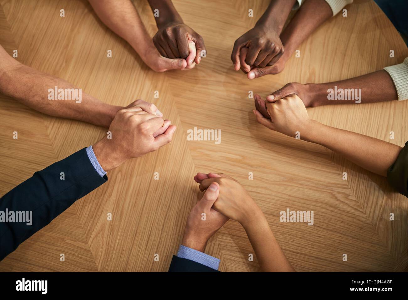 Diverse people holding hands in teamwork, success and support while ...