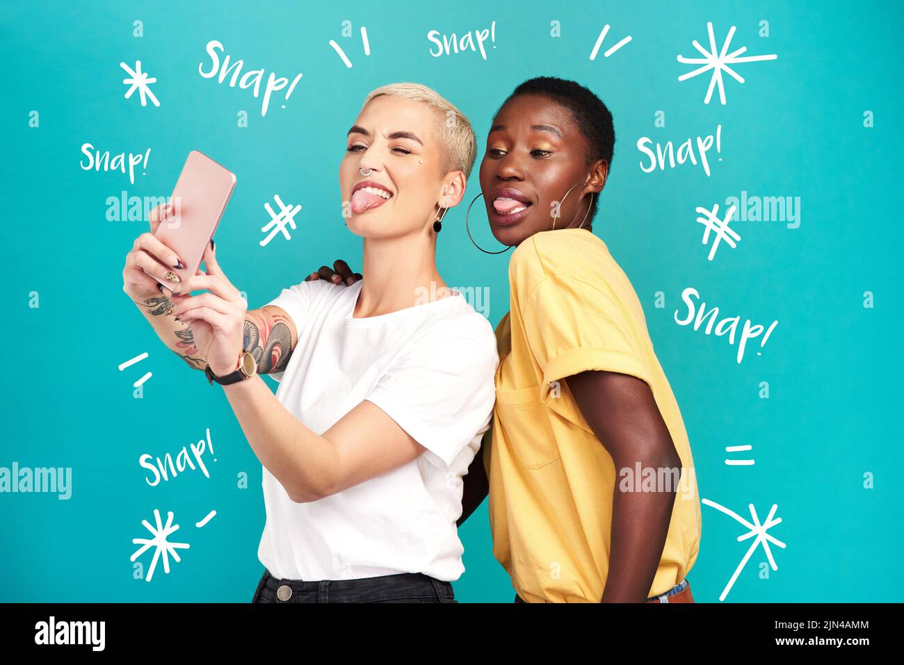 When life gets serious take lots of silly selfies. Studio shot of two ...