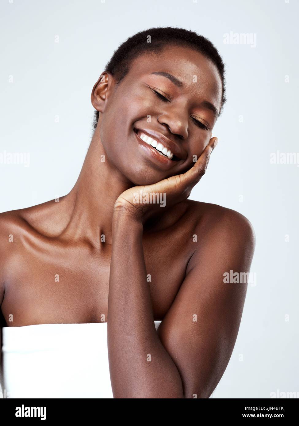 Skin that feels as soft as satin. Studio shot of a beautiful young ...