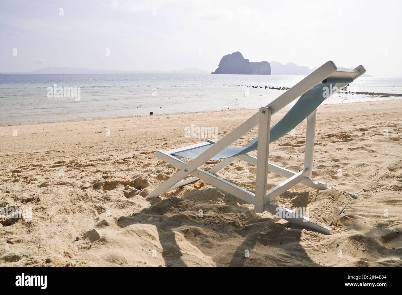 Relax foldable beach chair on sandy seashore in sunny day Stock Photo ...