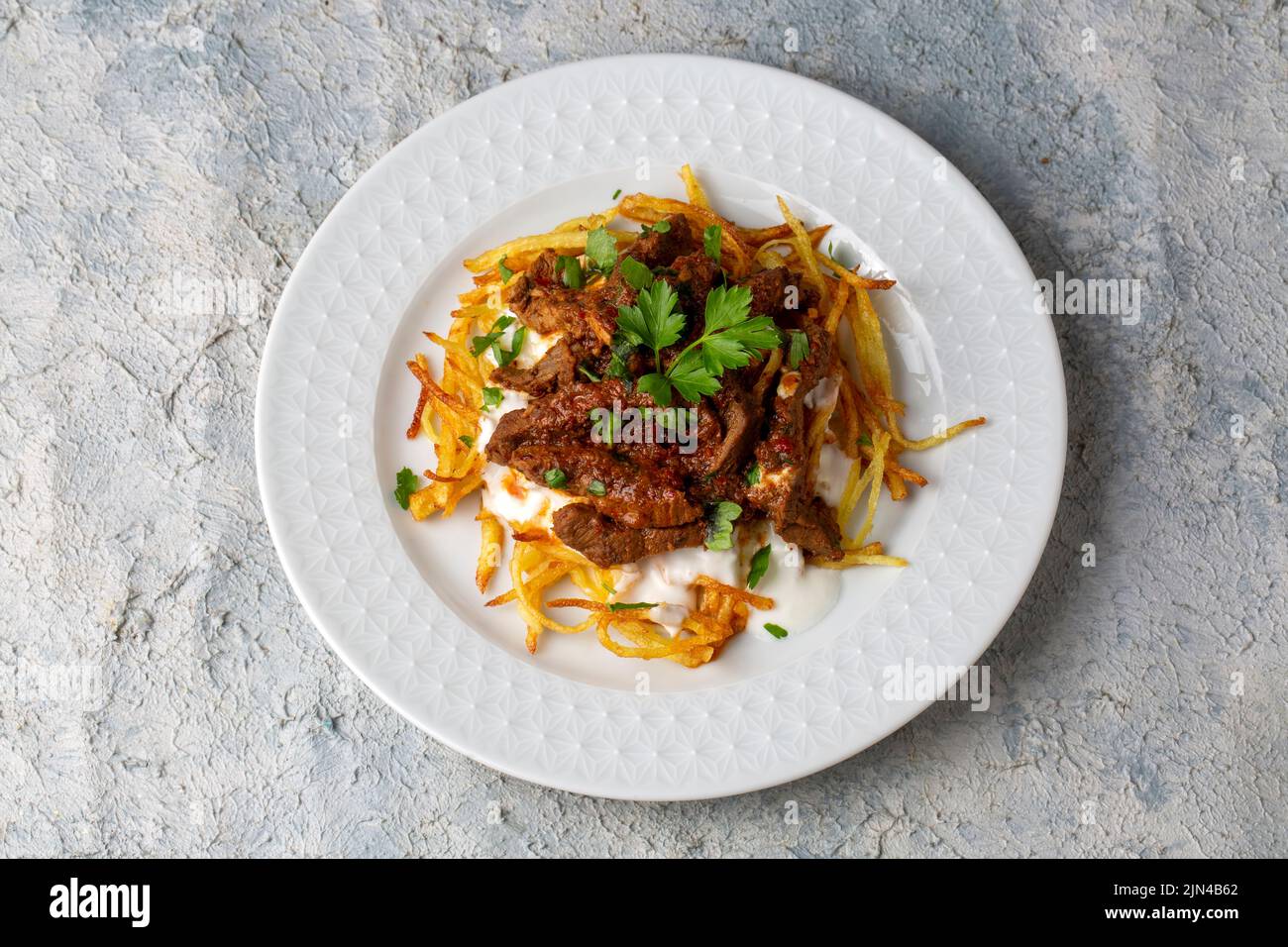 Turkish food; Cokertme Kebab - Beef meat kebab with yoghurt and french ...