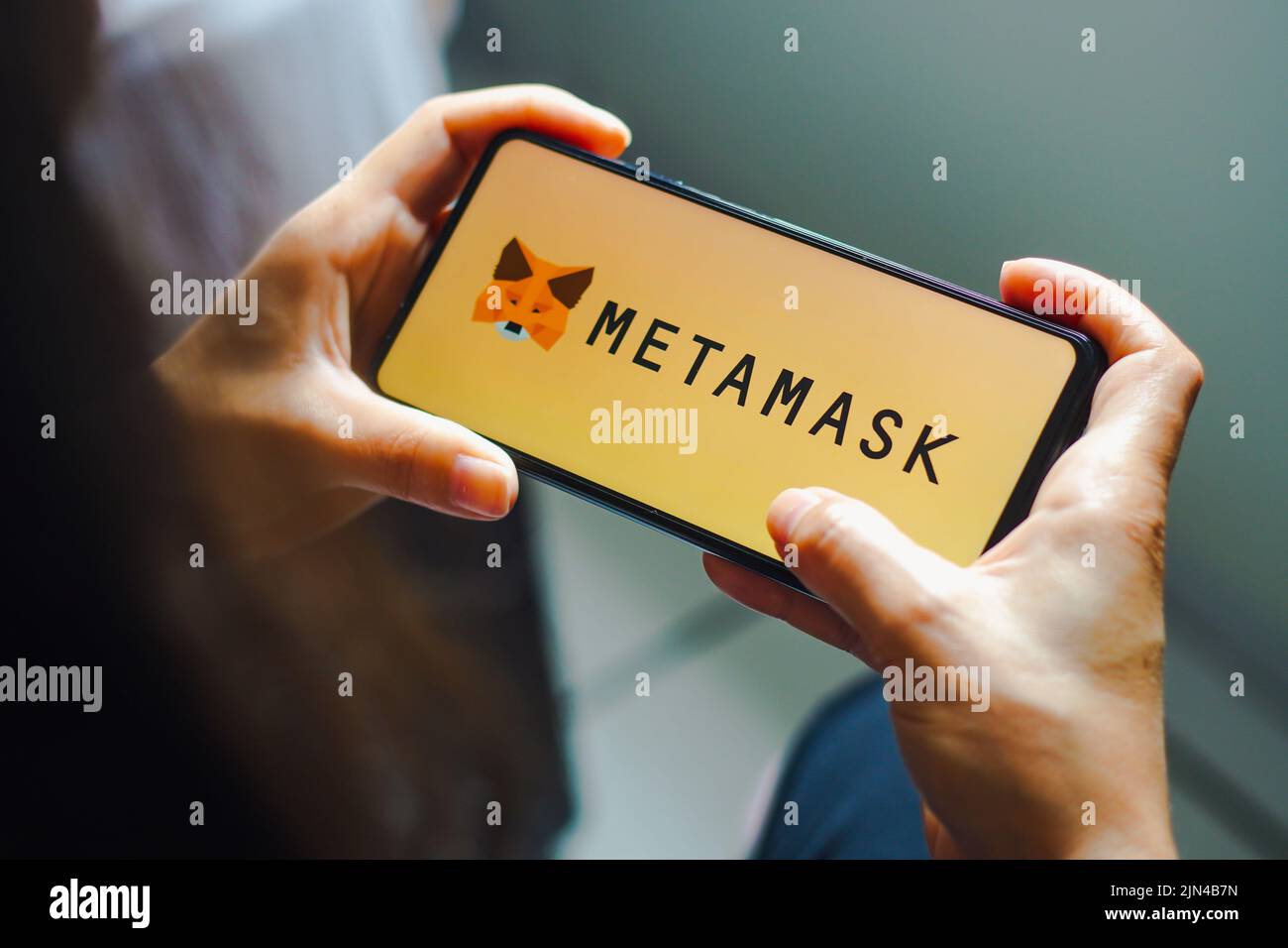 In this photo illustration, the MetaMask logo is displayed on a ...