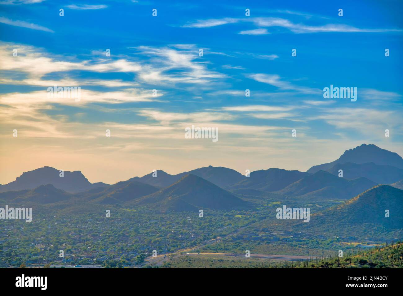 Silhoutte of mountain ranges against the sunset sky in Tucson, Arizona ...