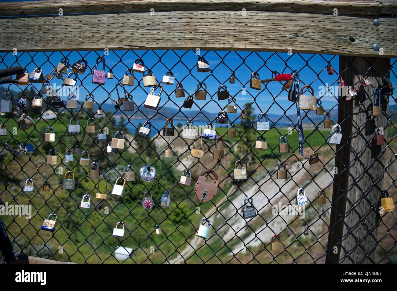 Love locks hanging on the fence of the bridge Stock Photo - Alamy