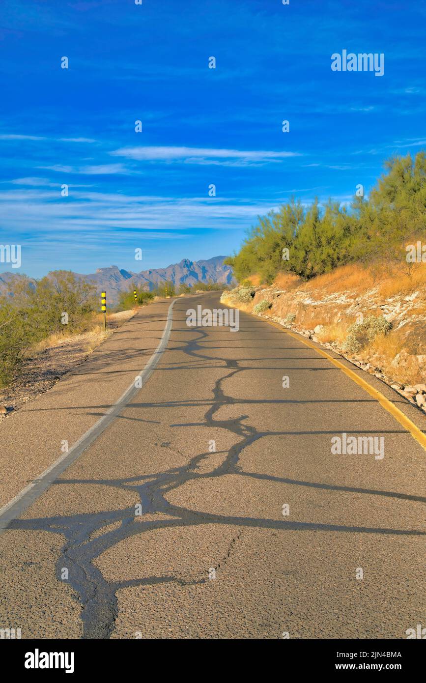 Asphalt road with cracks on mountain slope in Tucson, Arizona. Road ...