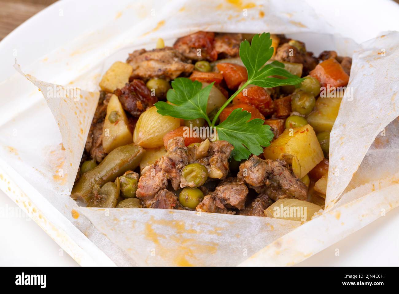 Traditional Turkish food; Meat with vegetables wrapped in greaseproof ...